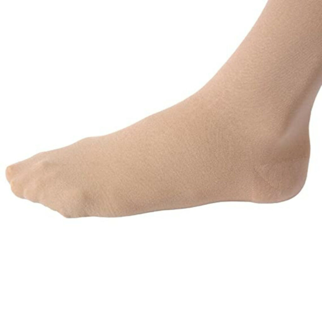 How do compression socks help while motorcycle riding?